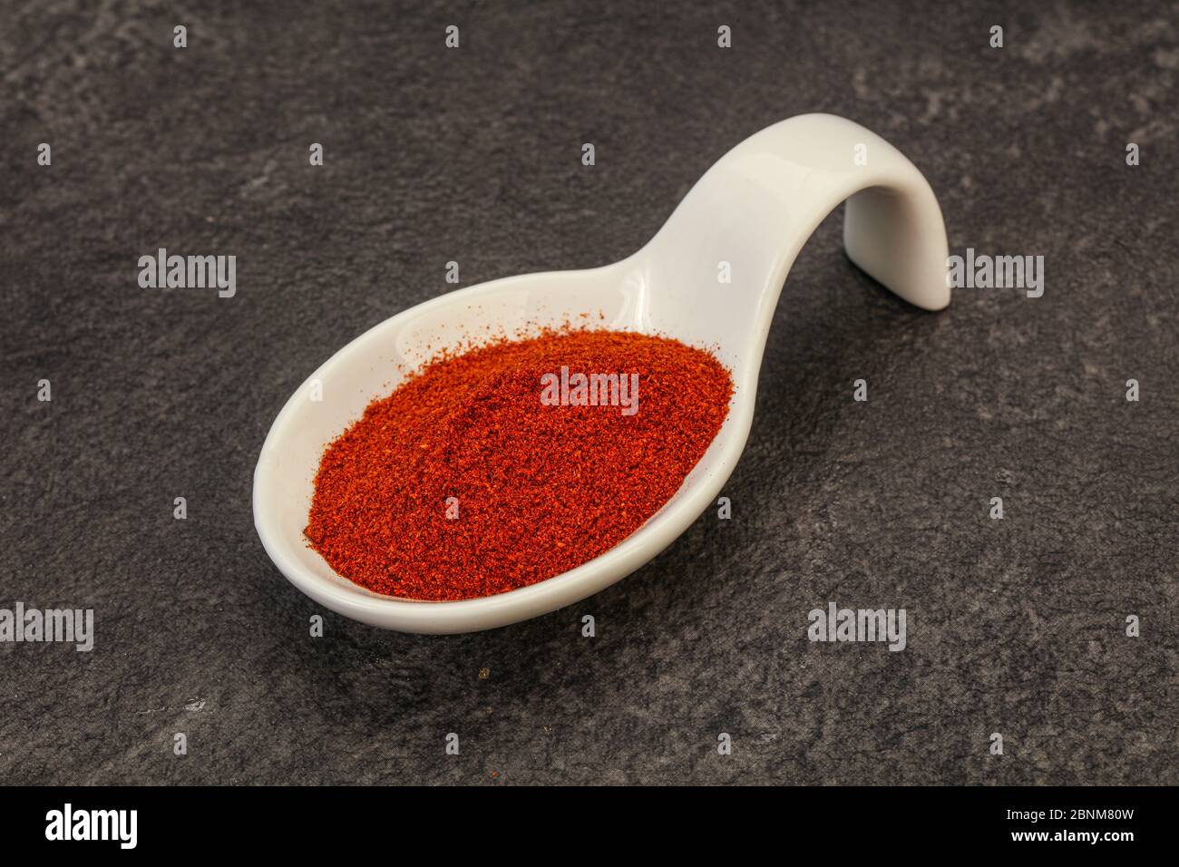 Dry paprika powder in the bowl for cooking Stock Photo - Alamy