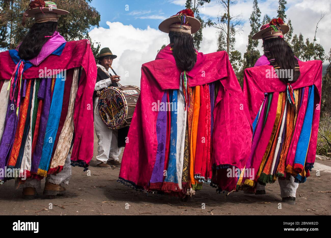 Indigenous Salasaca Indians in colourful garments, celebrating the Inti ...