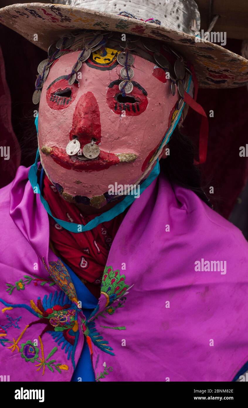 Indigenous Salasaca Indian in traditional mask, celebrating the Inti ...