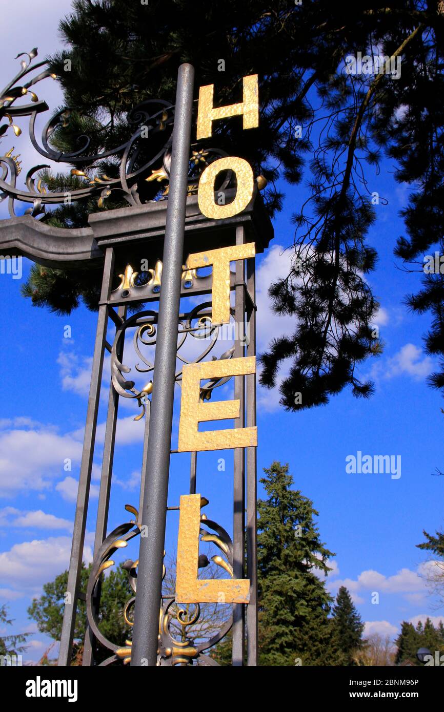 Wrought iron shield hotel, close-up Stock Photo - Alamy