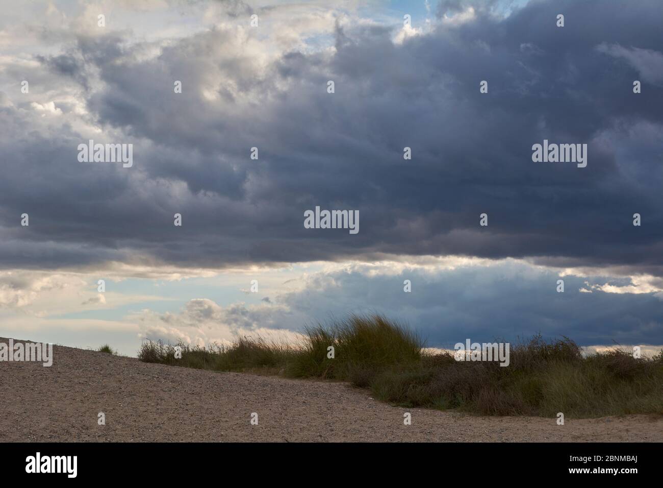 Landscape by the coast after the storm, dramatic clouds, sand Stock ...