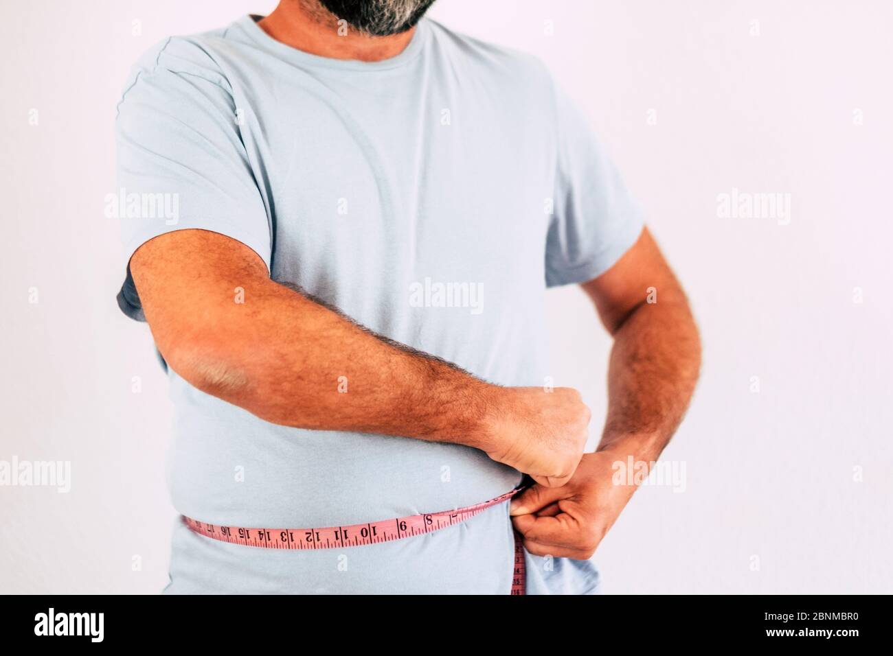 Man measures waist circumference hi-res stock photography and images ...