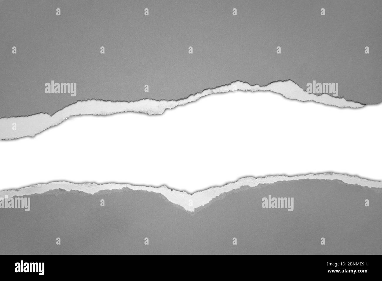 Ripped grey paper on white background Stock Photo - Alamy