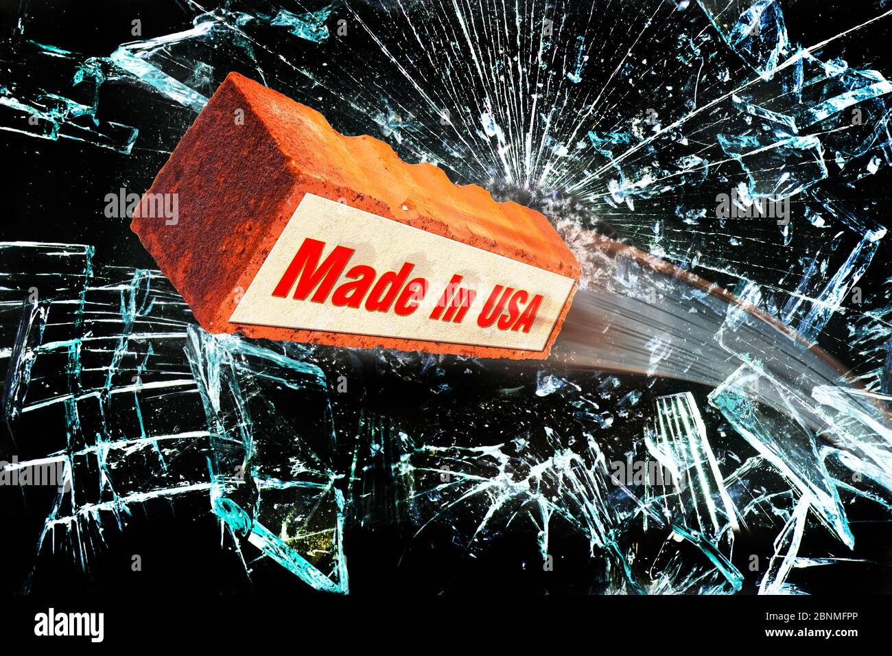 Made in USA with brick breaking glass window Stock Photo - Alamy
