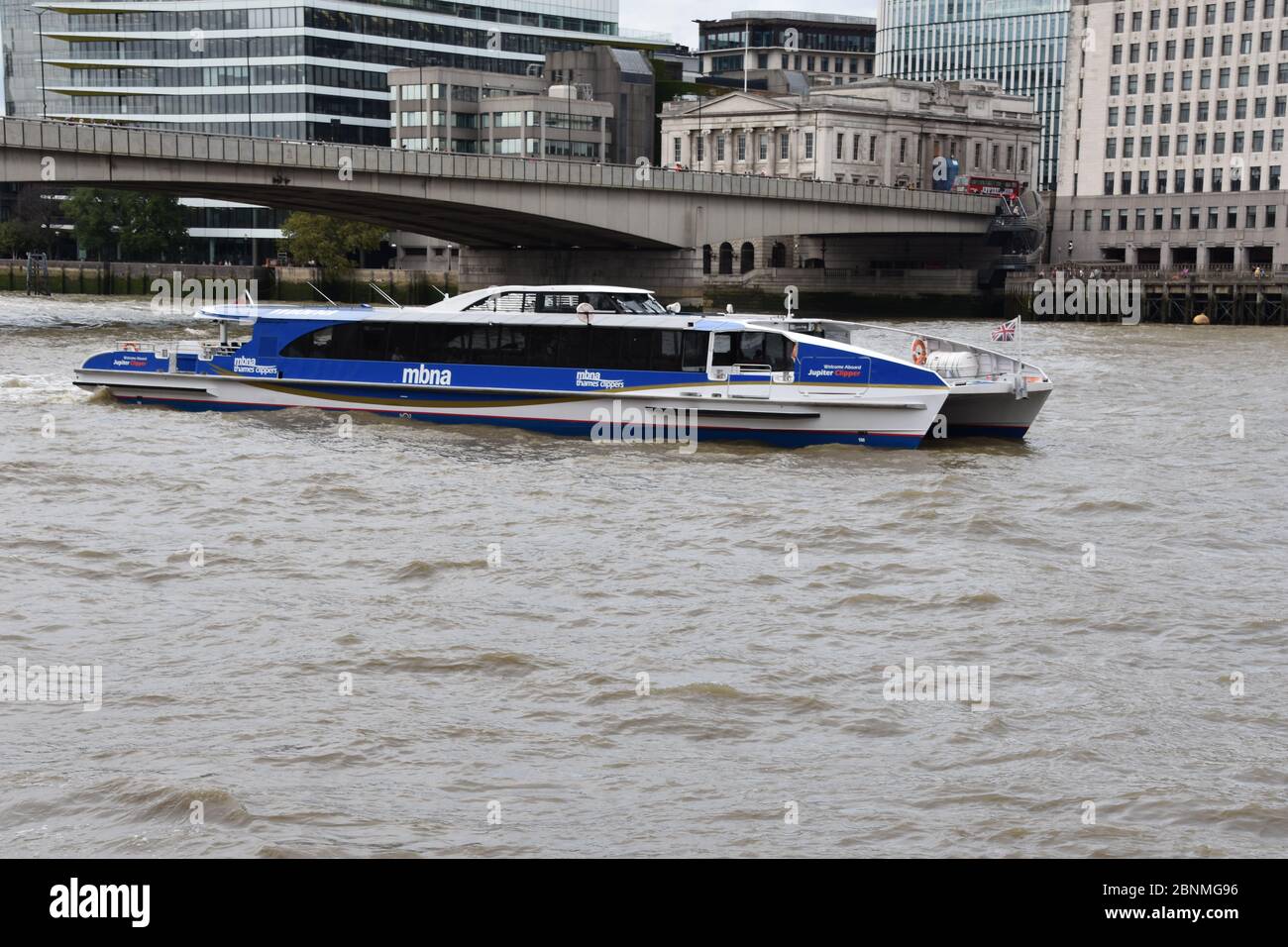 A tour cruise boat going down the River Thames, London, England, UK ...
