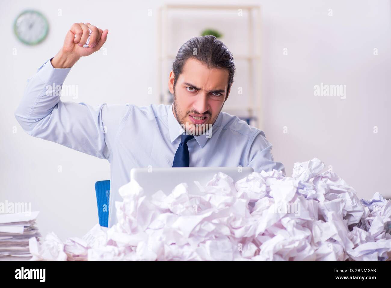 Businessman rejecting ideas with lots of papers Stock Photo - Alamy