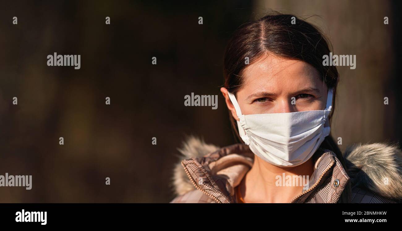 Young woman wearing white cotton home made virus mouth nose mask in ...