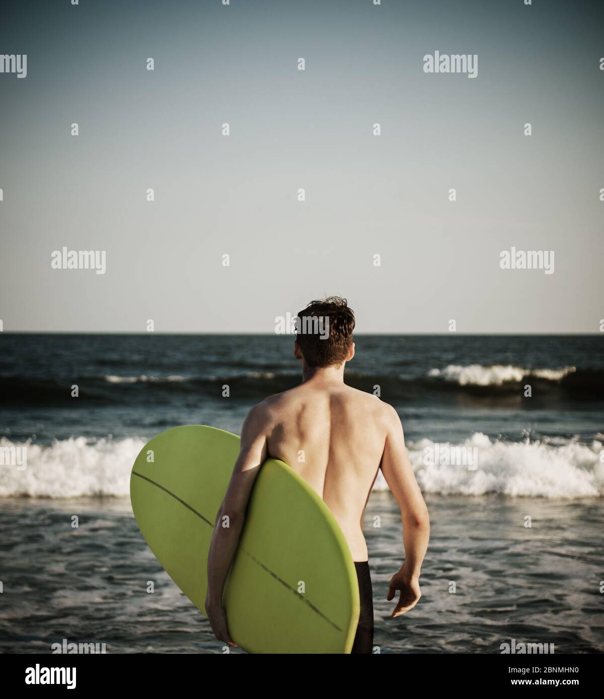 Boy with surfboard hi-res stock photography and images - Alamy