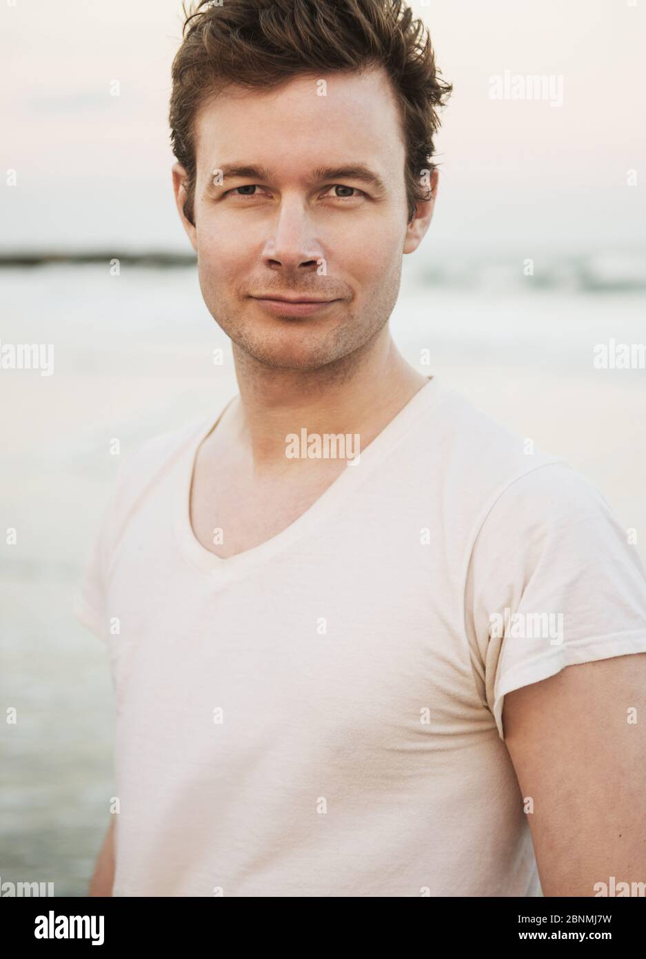 portrait of young man at the beach Stock Photo - Alamy