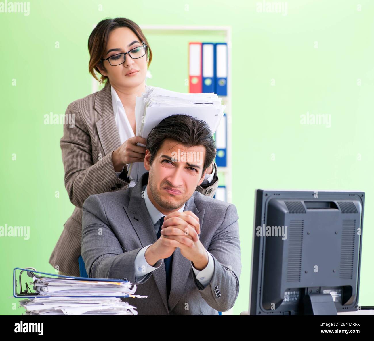 The man employee suffering from excessive work Stock Photo - Alamy