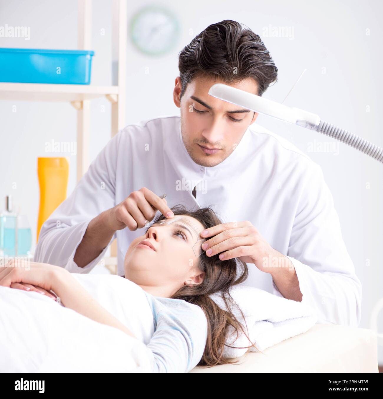 The doctor measuring patient's face before plastic surgery Stock Photo ...
