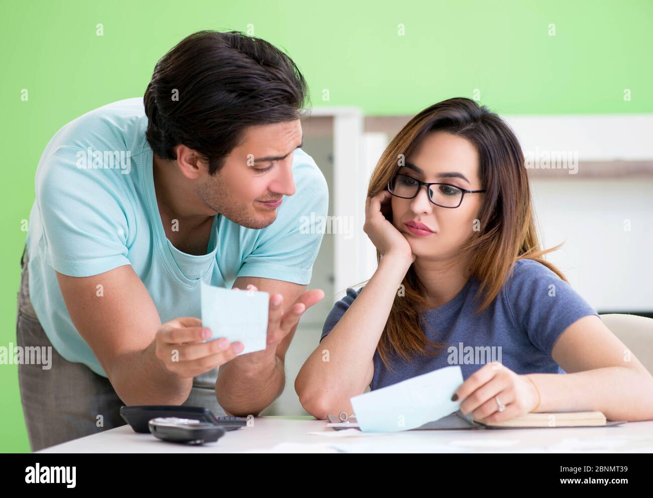 The young family struggling with personal finance Stock Photo - Alamy