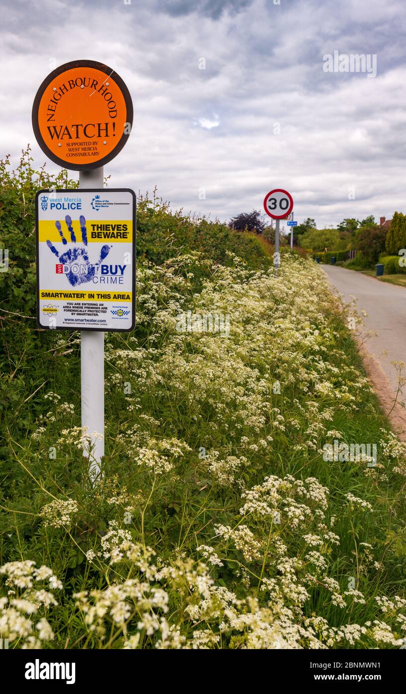 Roadside signs covered by vegetation, Shropshire England Stock Photo ...