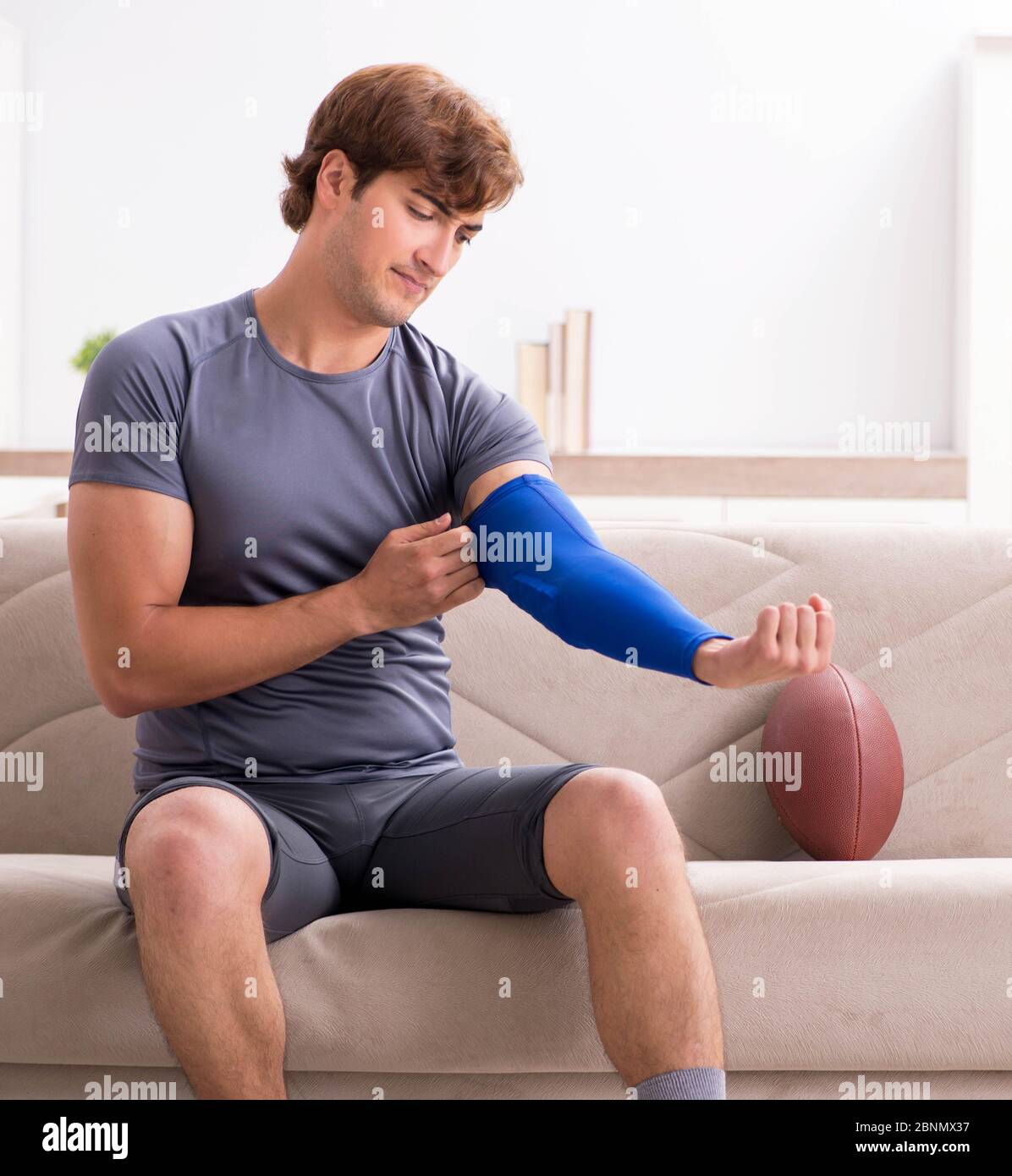 The injured man recovering at home from sports injury Stock Photo - Alamy