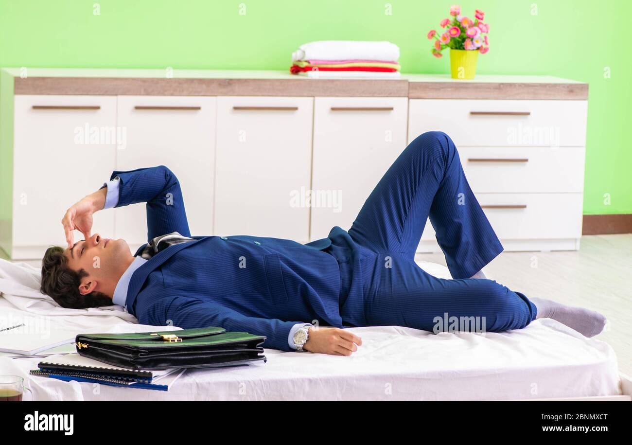 The businessman working overtime in hotel room Stock Photo - Alamy