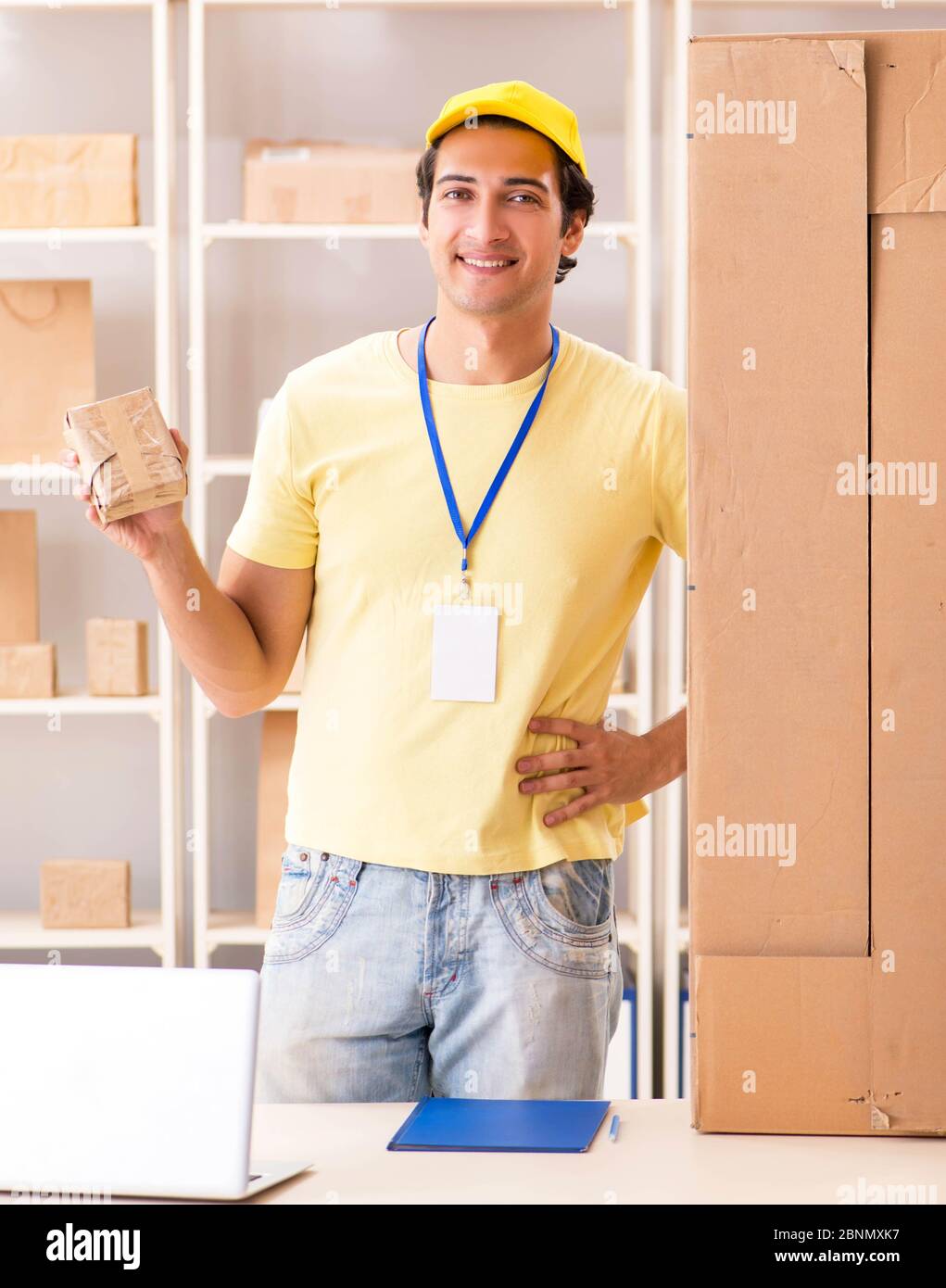 The handsome contractor working in box delivery relocation service ...