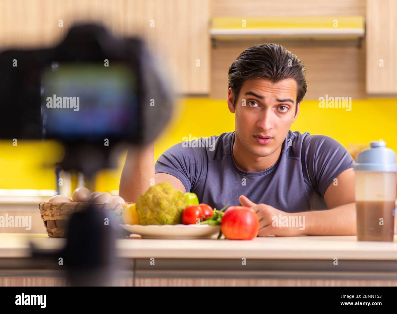 The young man blogging about food supplements Stock Photo - Alamy
