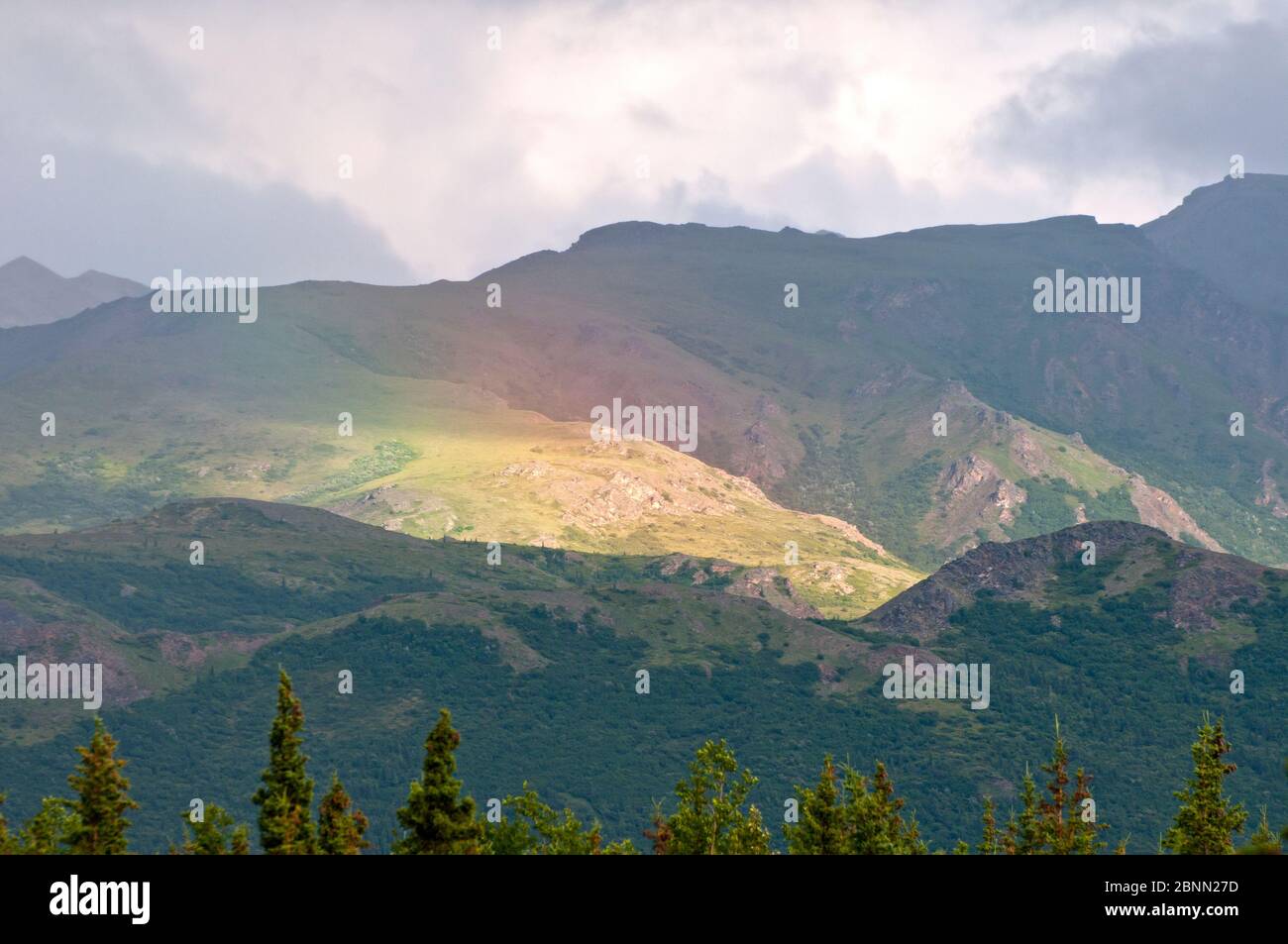 Sun rays over Denali National Park, Alaska Stock Photo - Alamy