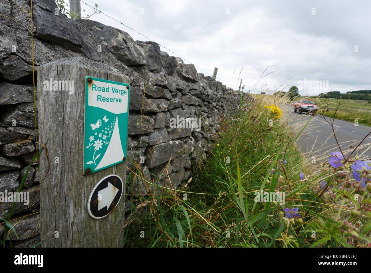 Roadside verge reserve sign, near Wardlow, Peak District National Park ...