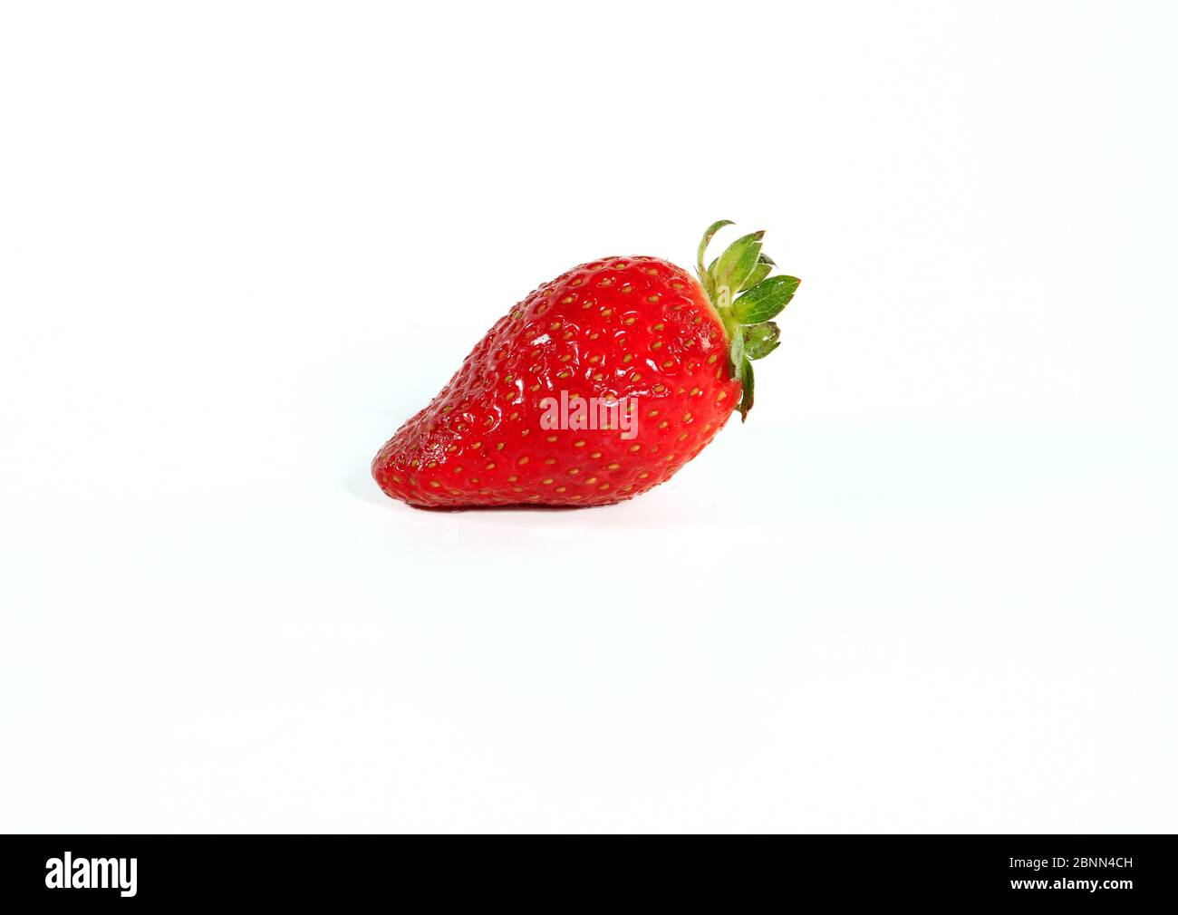 Fresh Strawberry lying on a white background Stock Photo - Alamy