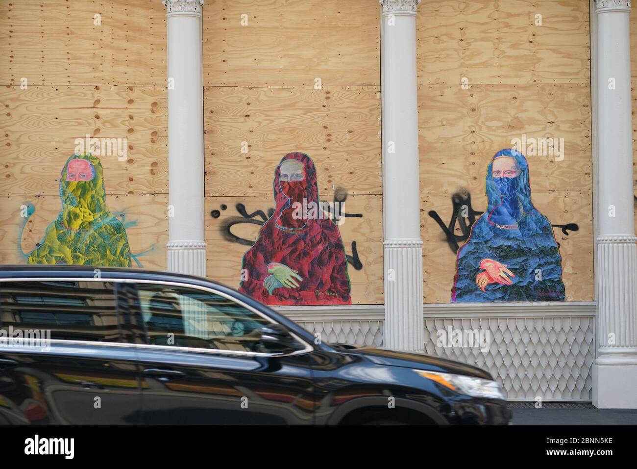 New York, NY, USA. 15th May, 2020. A car drives past COVID-19 inspired ...