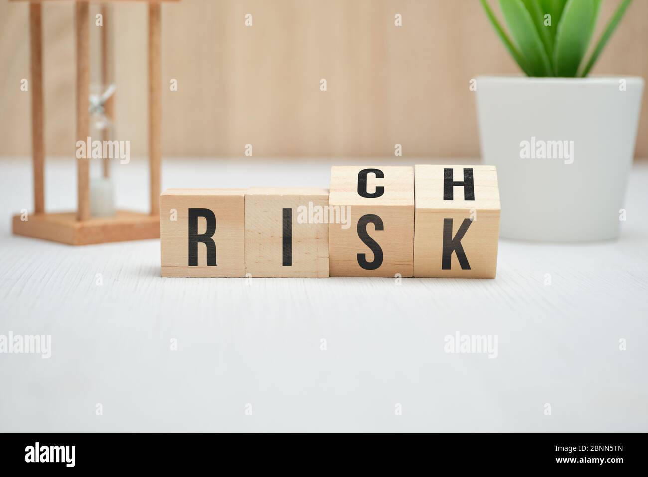 Abstract words risk and rich on wooden cubes. Close up Stock Photo - Alamy