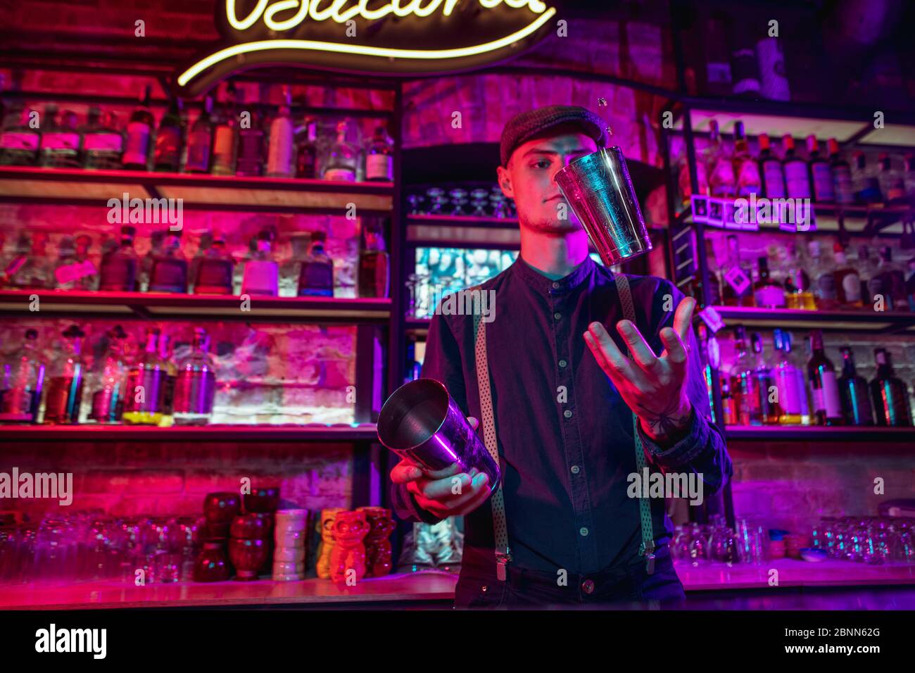 Professional barman finishes preparation of alcoholic cocktail for ...