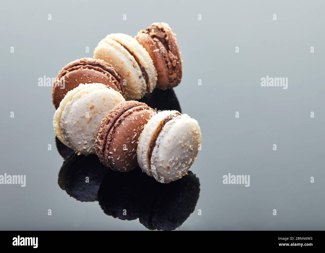 Coconut flavored macaroons on a gray background with reflection Stock ...