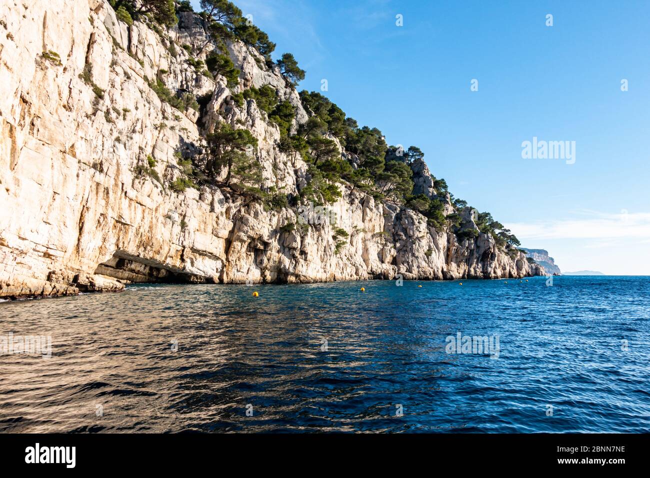 The scenic limestone cliffs at the entrance of the Calanque d’En-Vau ...
