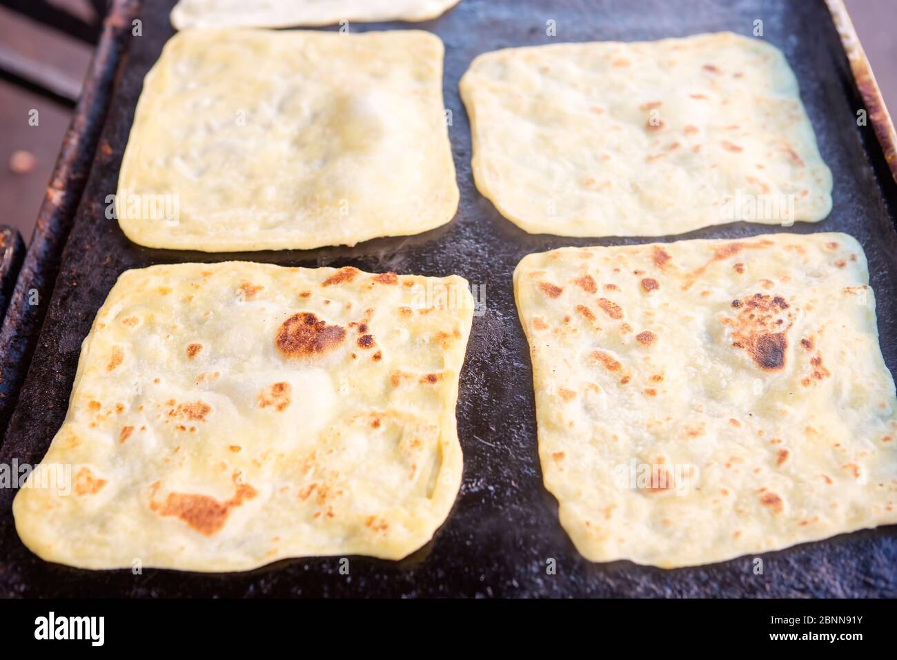 Preparation of Moroccan msemen pancakes Stock Photo - Alamy