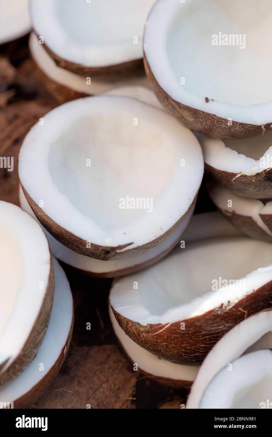 Coconut in shell halved halves, Morocco Stock Photo - Alamy