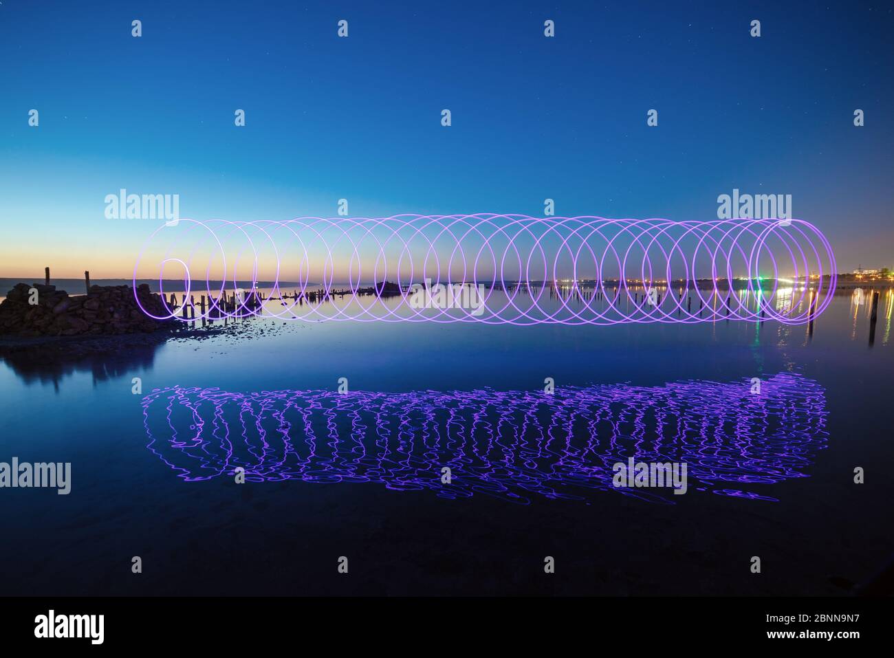 Amazing laser fireshow performance in the night blue sky with ...