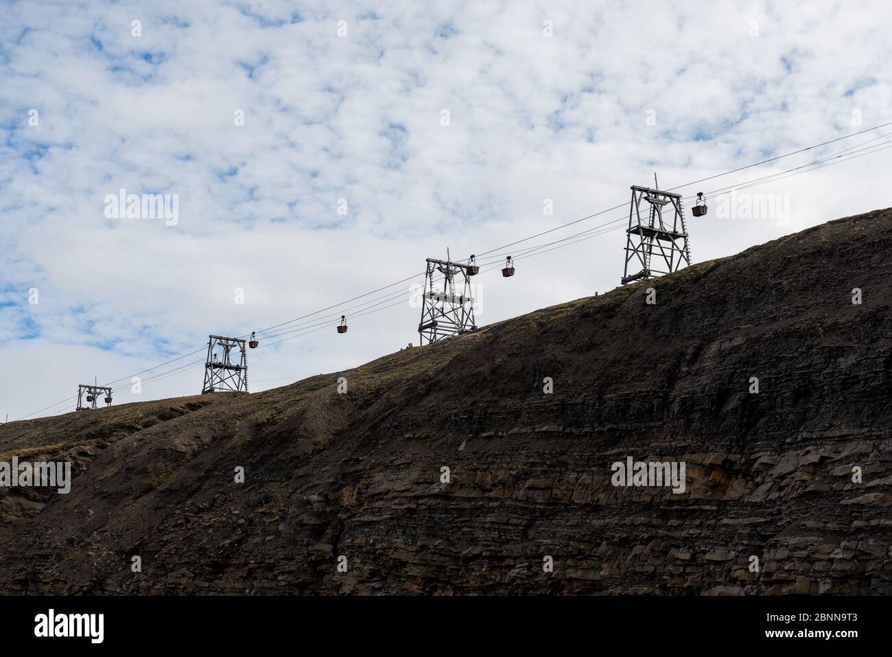 Arctic landscape with old wooden mine transportation cableway in ...