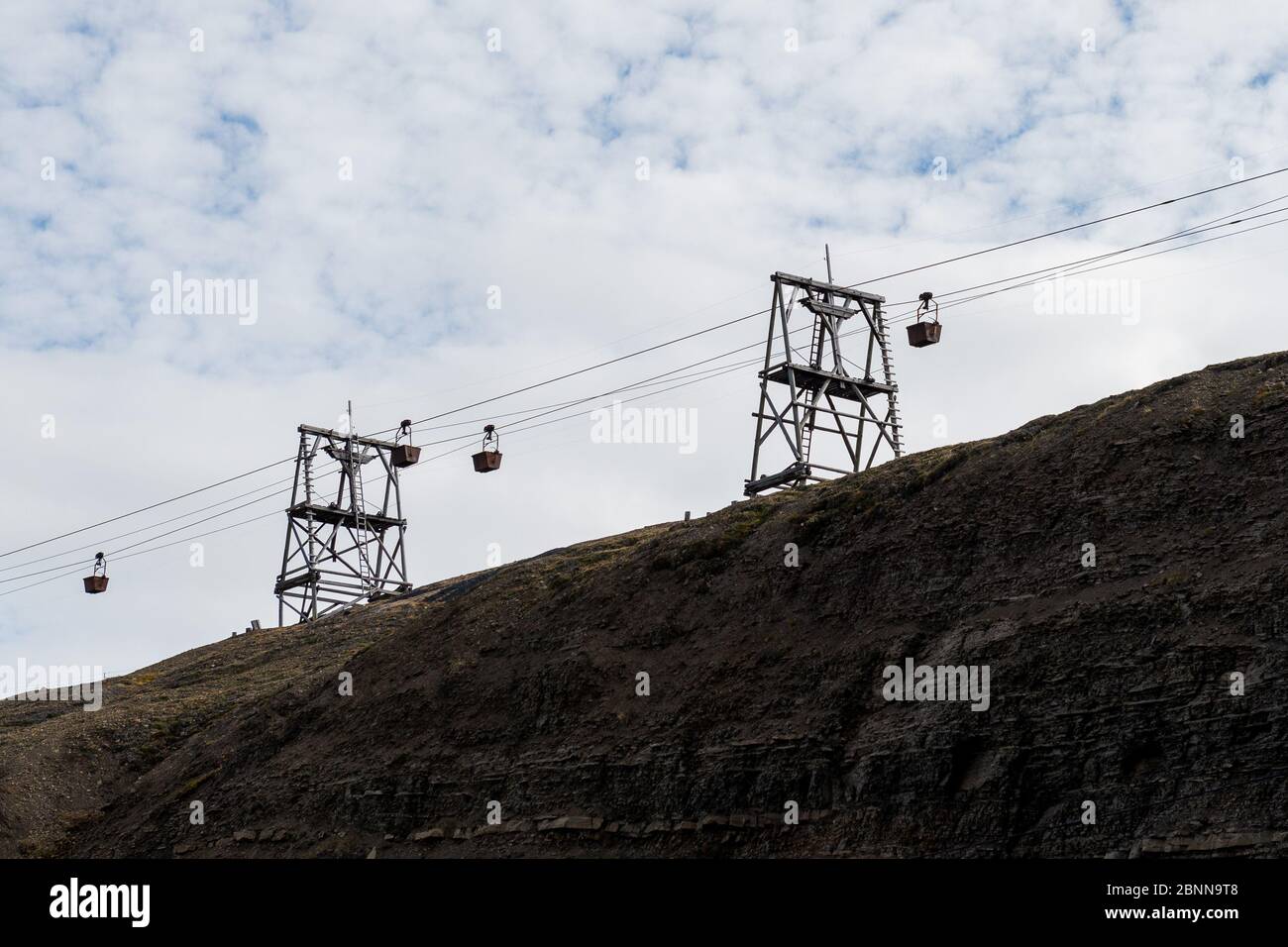 Arctic landscape with old wooden mine transportation cableway in ...