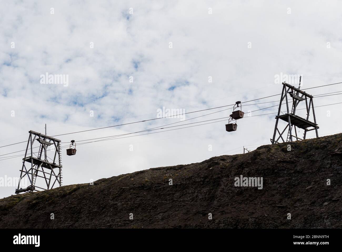 Arctic landscape with old wooden mine transportation cableway in ...