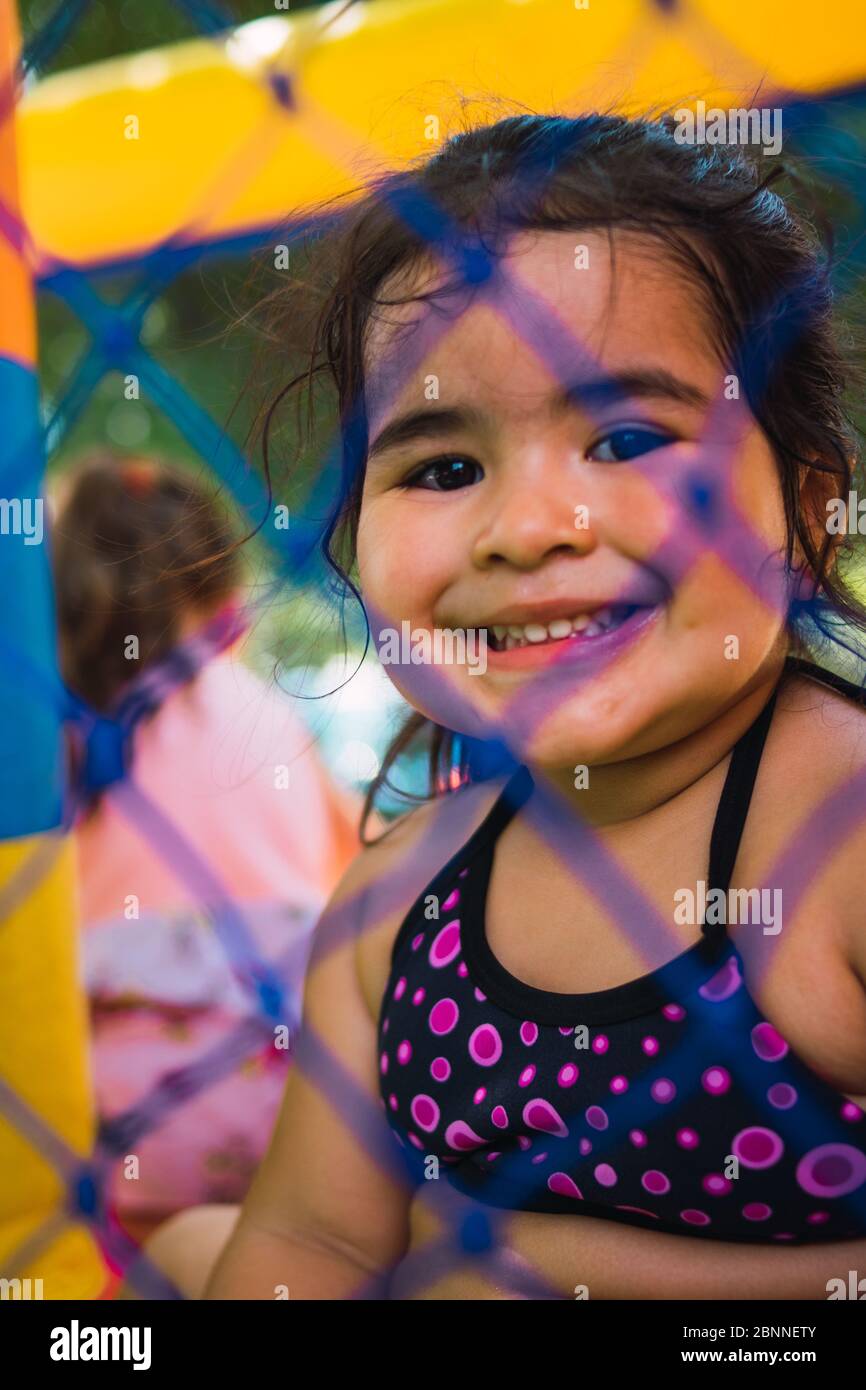 girl smiling in a ball game Stock Photo - Alamy
