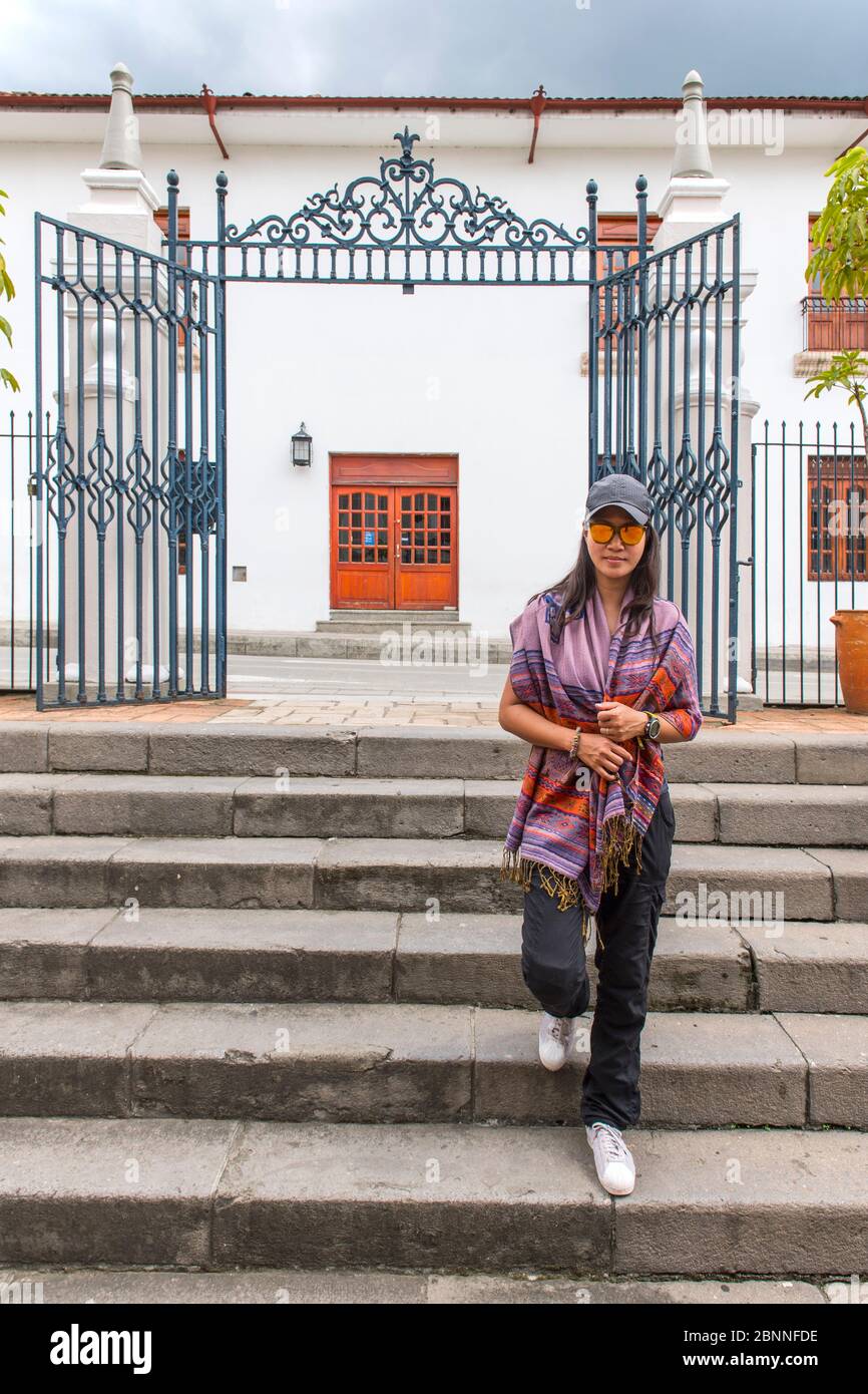 Woman walking down steps in the white city of Popayan, Colombia Stock ...