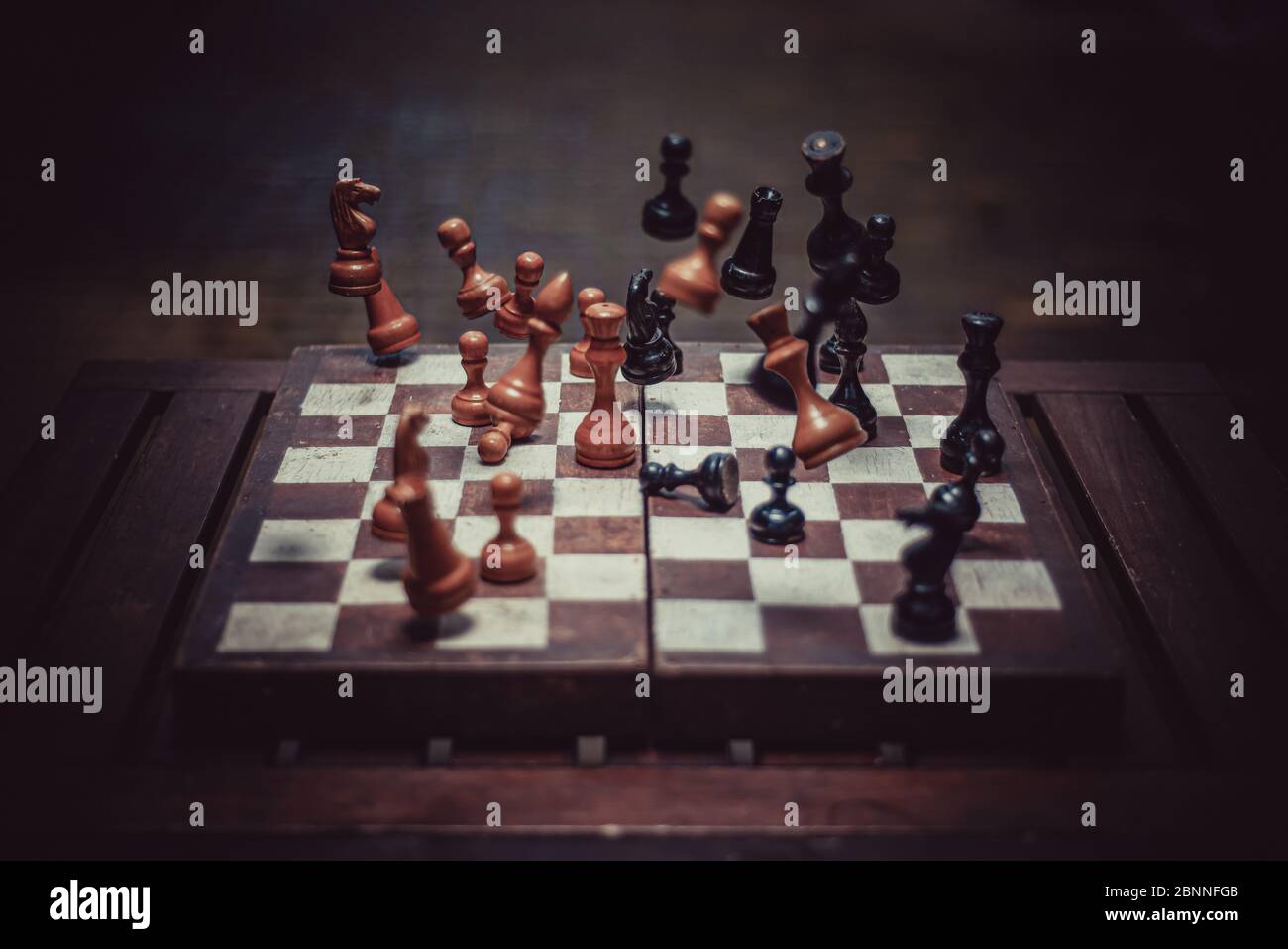 falling chess pieces on the chessboard Stock Photo - Alamy