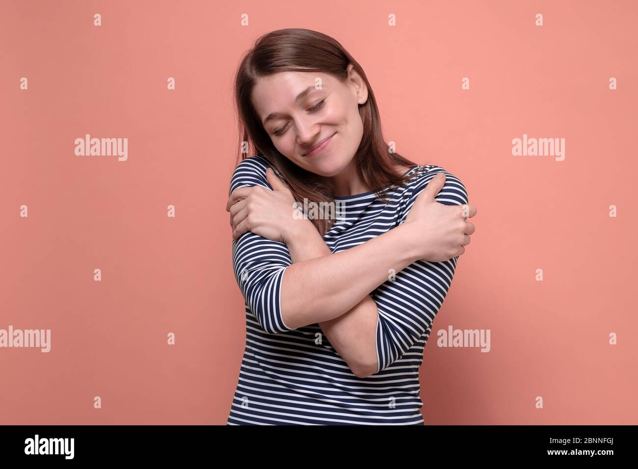 Young Beautiful Woman Hugging Herself Happy And Positive Smiling Confident Self Love And Self 