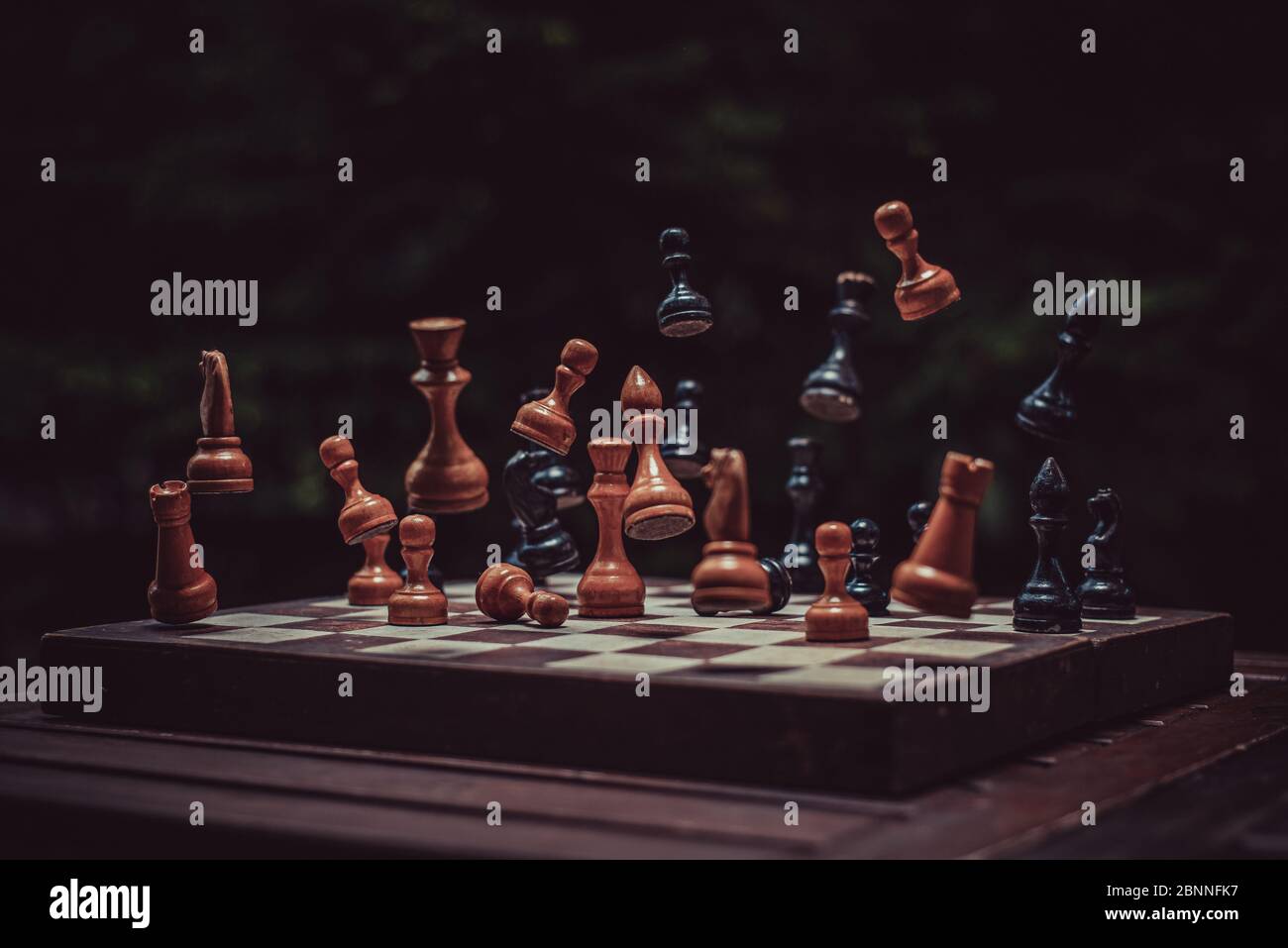 falling chess pieces on the chessboard Stock Photo - Alamy