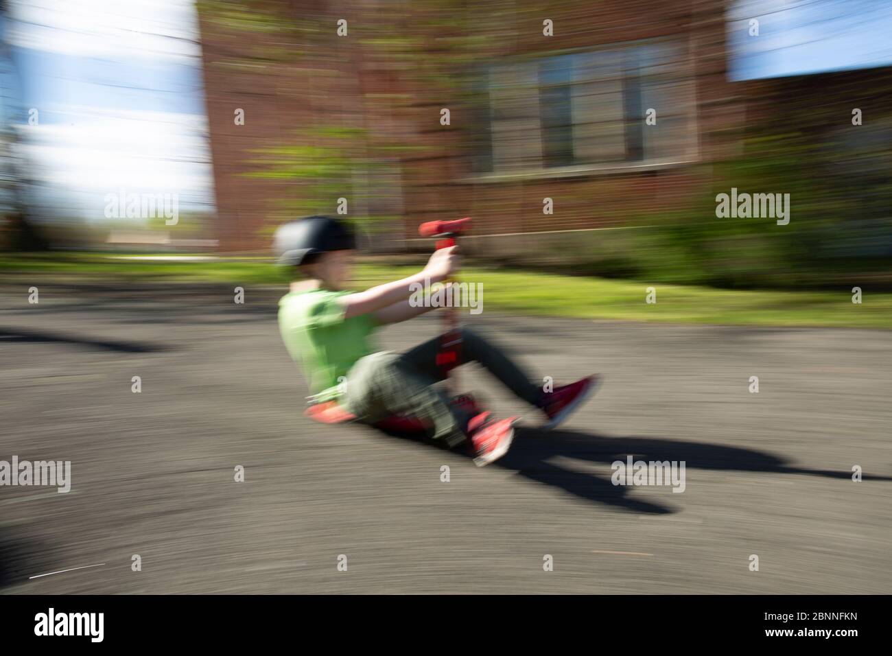 Boy scootering blur hi-res stock photography and images - Alamy