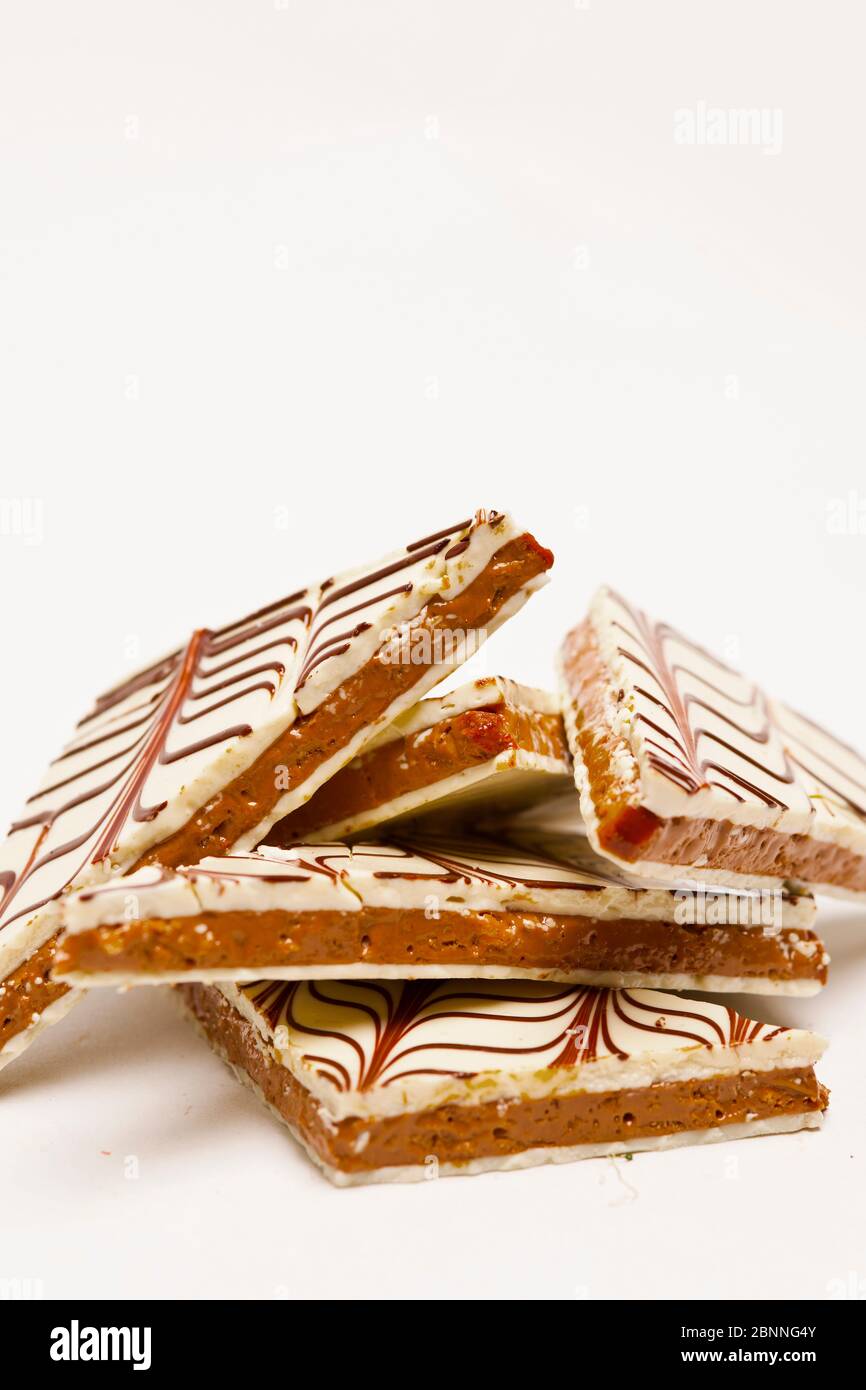 stack of caramel sweets on white background Stock Photo - Alamy