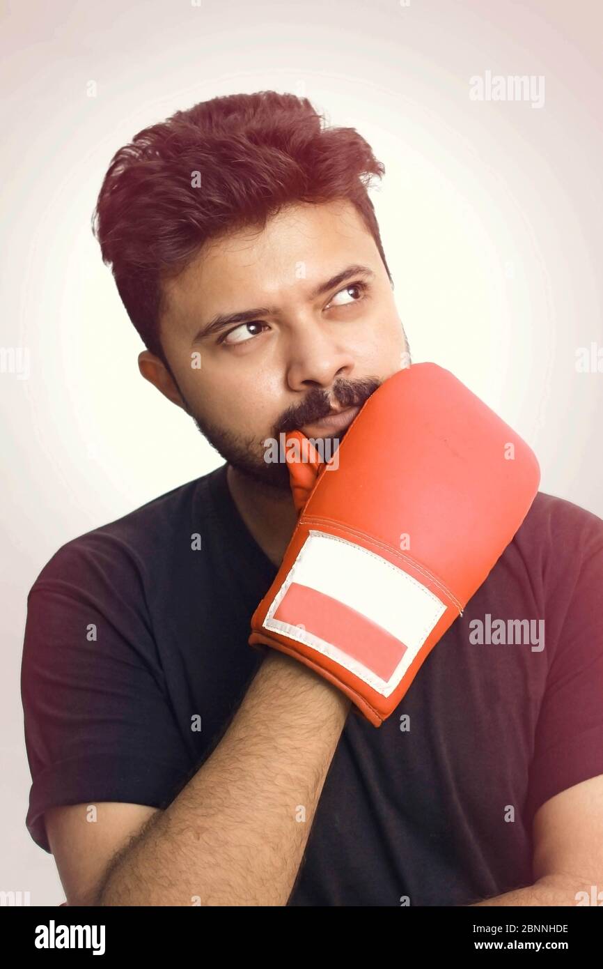 Young Men Wearing Black T Shirt Looking Up And Thinking, Wearing Red ...