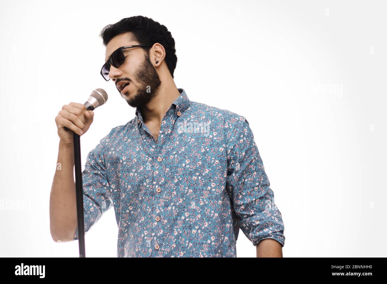 Young Men Holding A Mic Wearing A Glasses And Singing A Song Stock ...