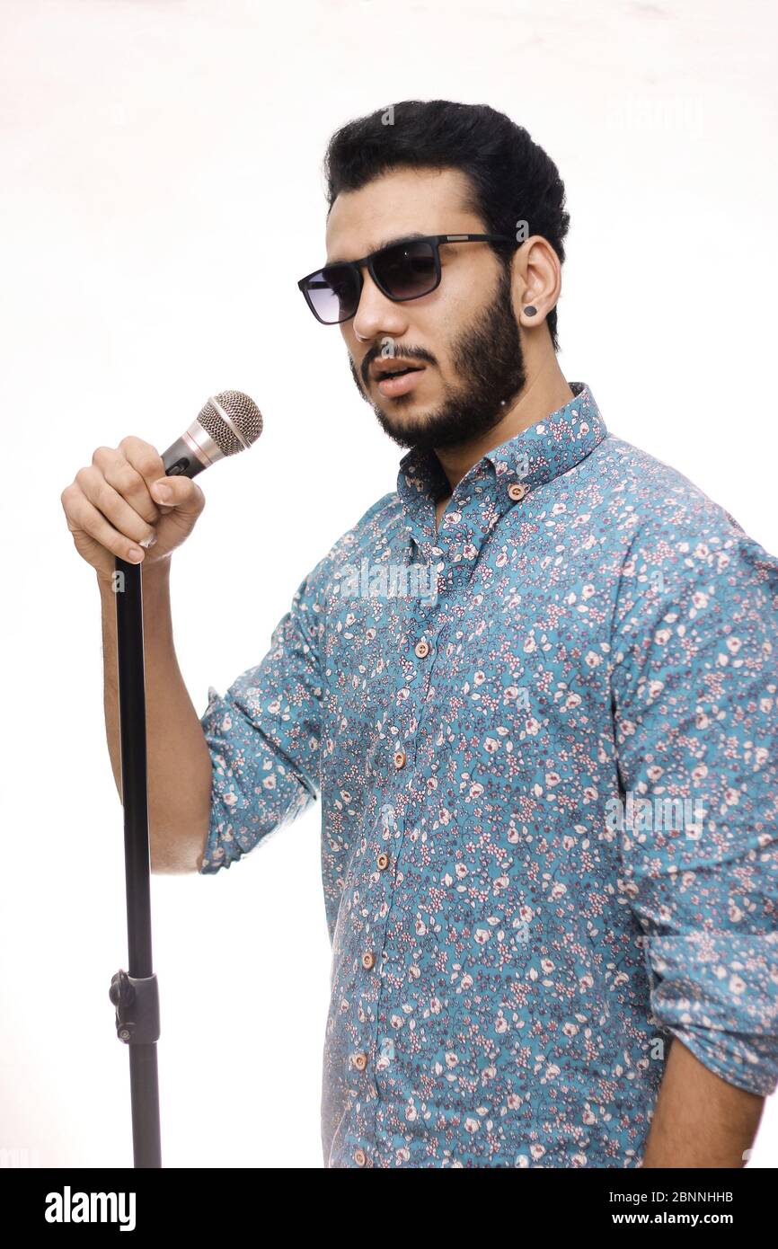 Young Men Holding A Mic Wearing A Glasses And Singing A Song Stock ...