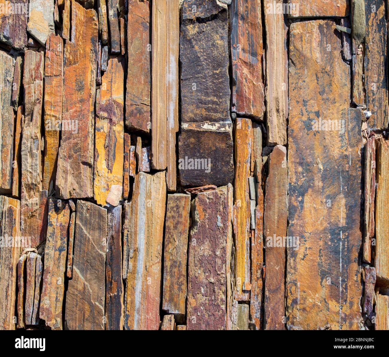 background texture -close up of jagged quartz and granite stonework on ...