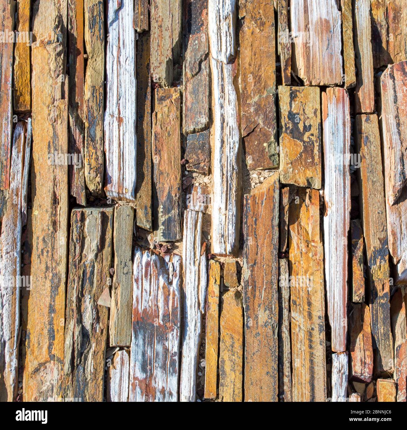 background texture -close up of jagged quartz and granite stonework on ...