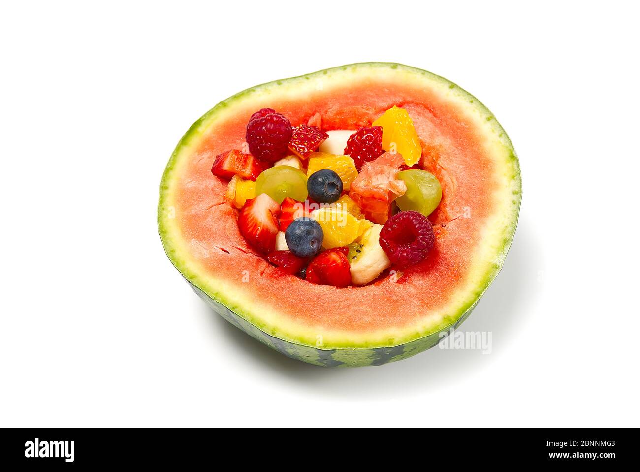 Watermelon filled with fresh fruit salad. isolated on white background ...