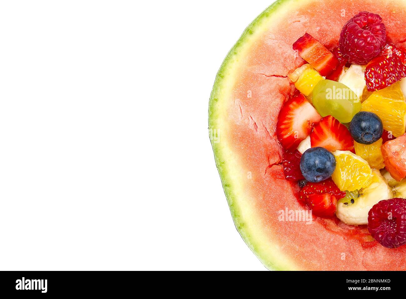 Watermelon filled with fresh fruit salad. isolated on white background ...