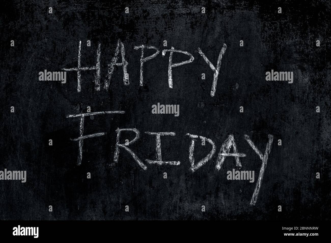 Happy Friday wrote on the rough wall with yellow-colored chalk, close ...